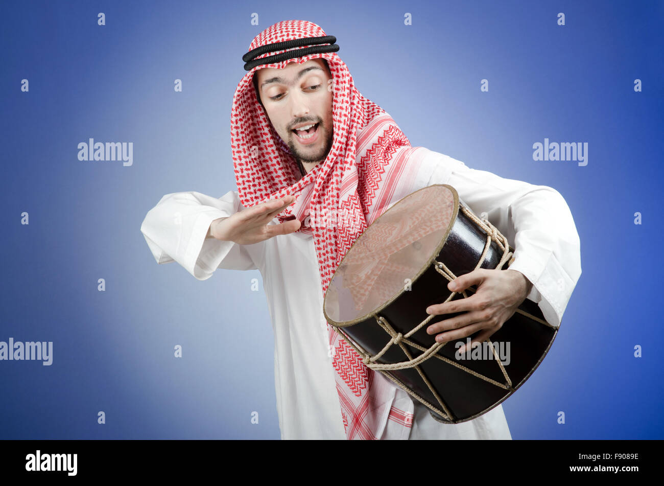 Arab playing drum in studio shooting Stock Photo - Alamy