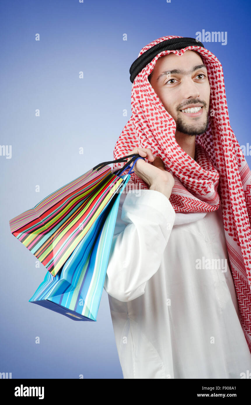 Arab with the gift bags Stock Photo - Alamy