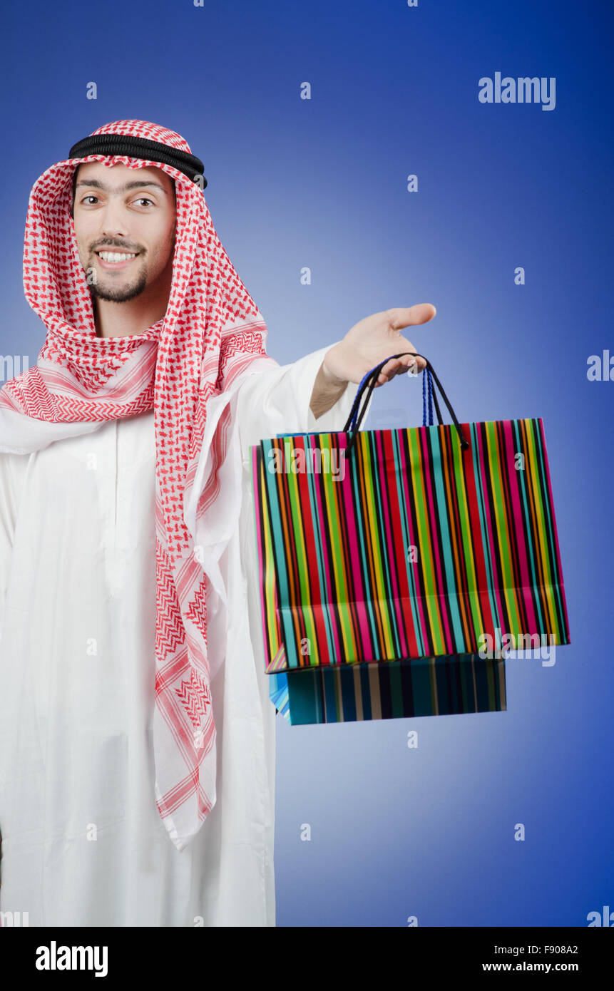 Arab with the gift bags Stock Photo - Alamy