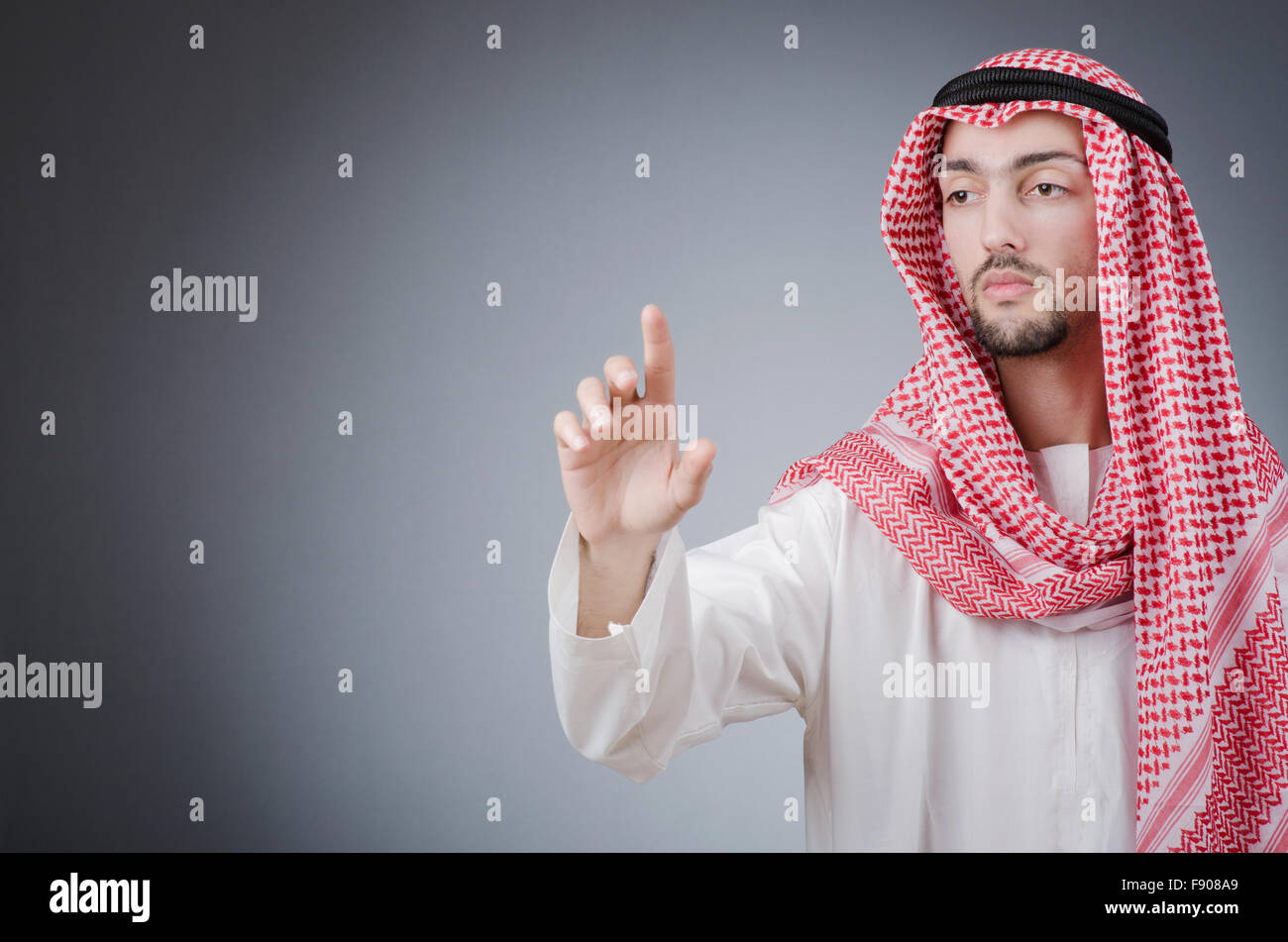 Arab pushing virtual buttons Stock Photo - Alamy
