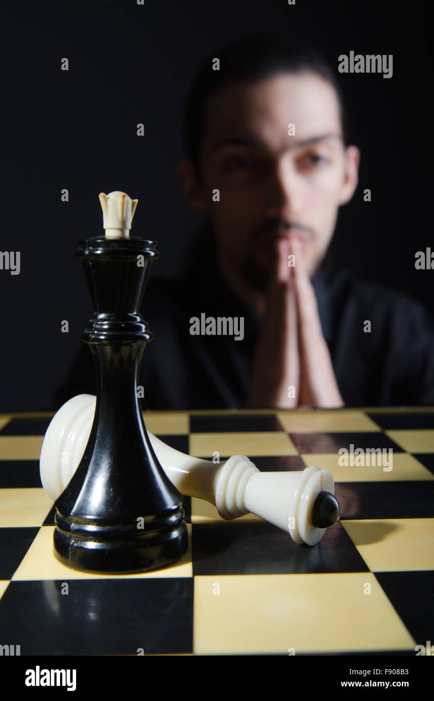 Chess player playing his game Stock Photo - Alamy