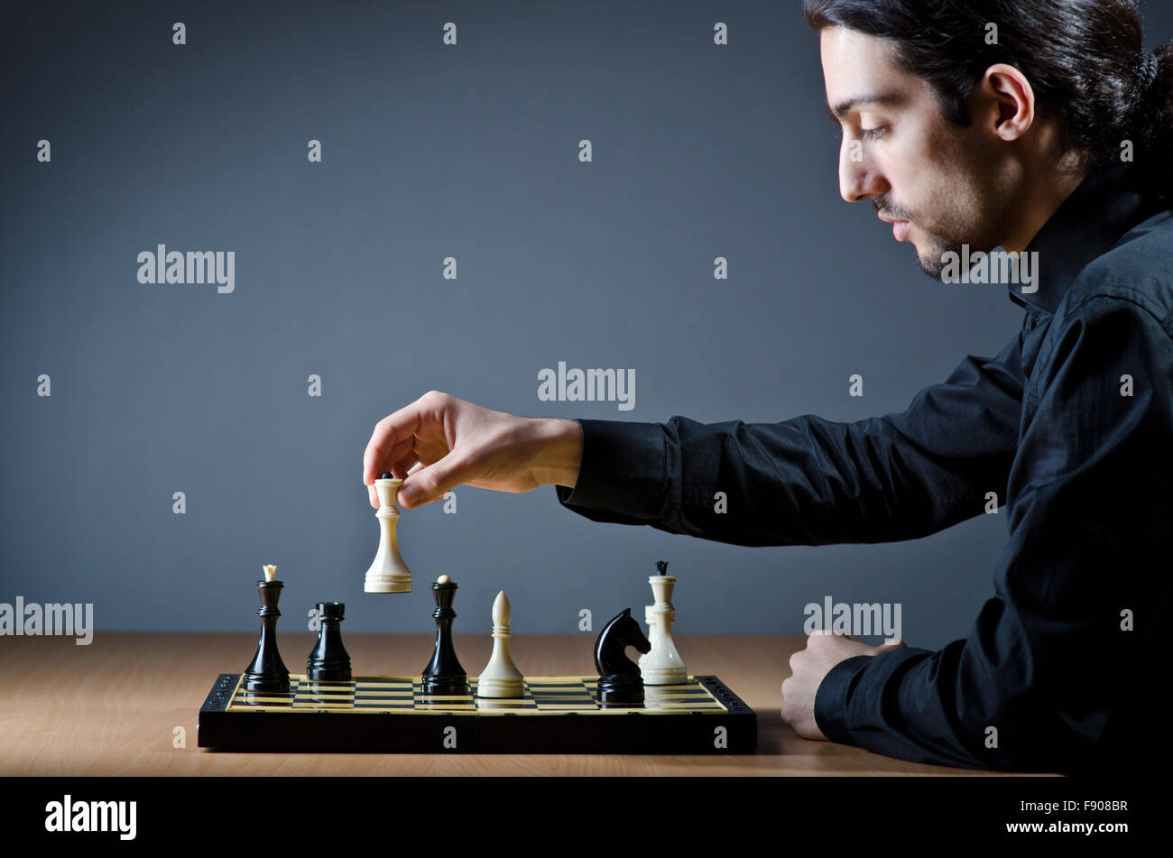 Chess player playing his game Stock Photo - Alamy
