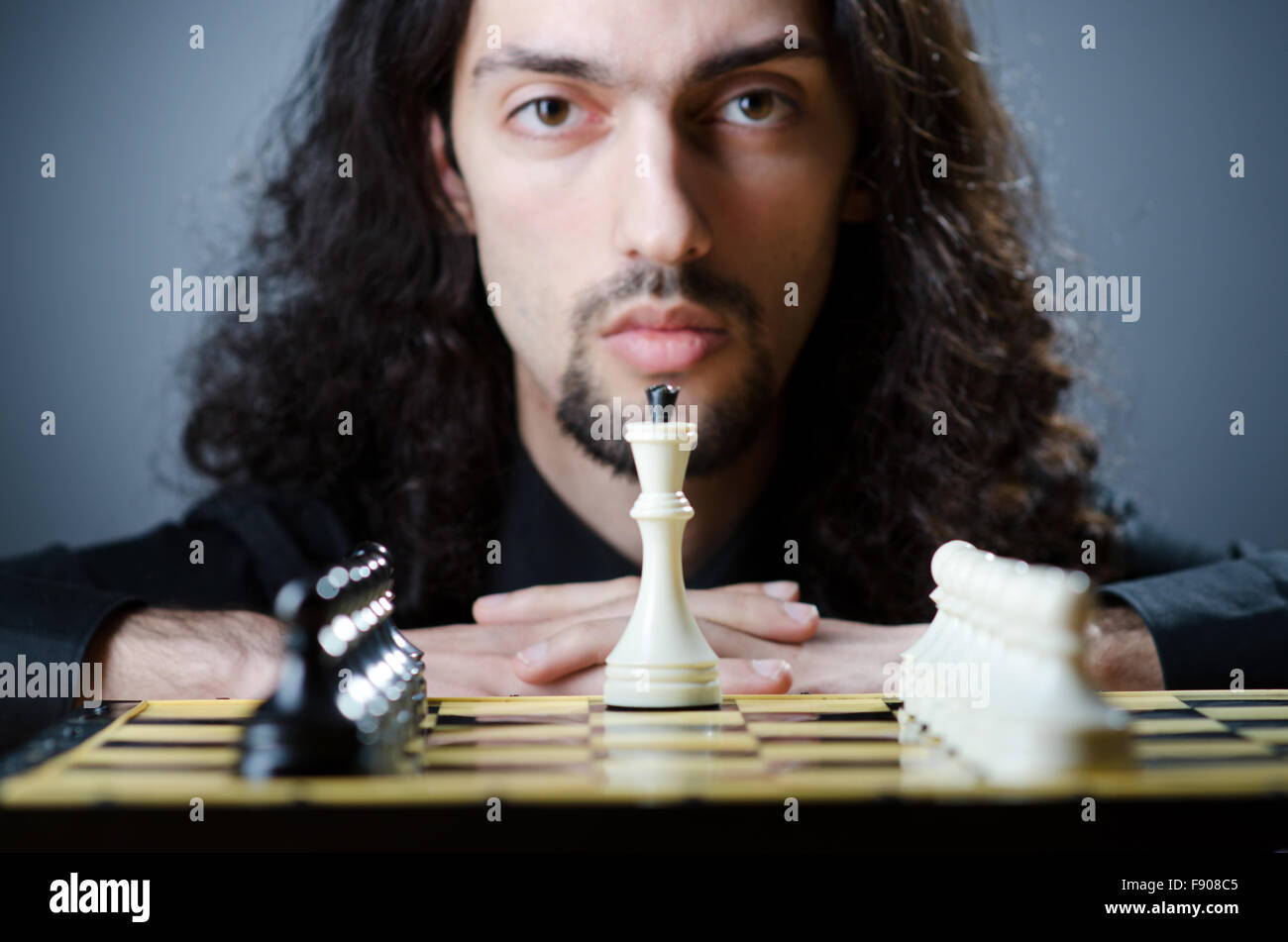 Chess player playing his game Stock Photo - Alamy