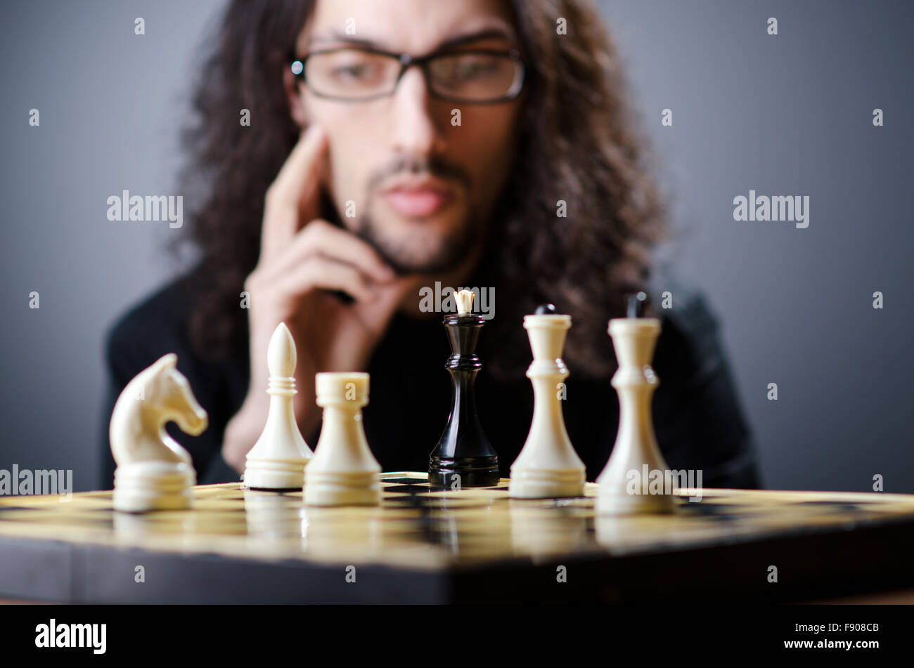 Chess player playing his game Stock Photo - Alamy