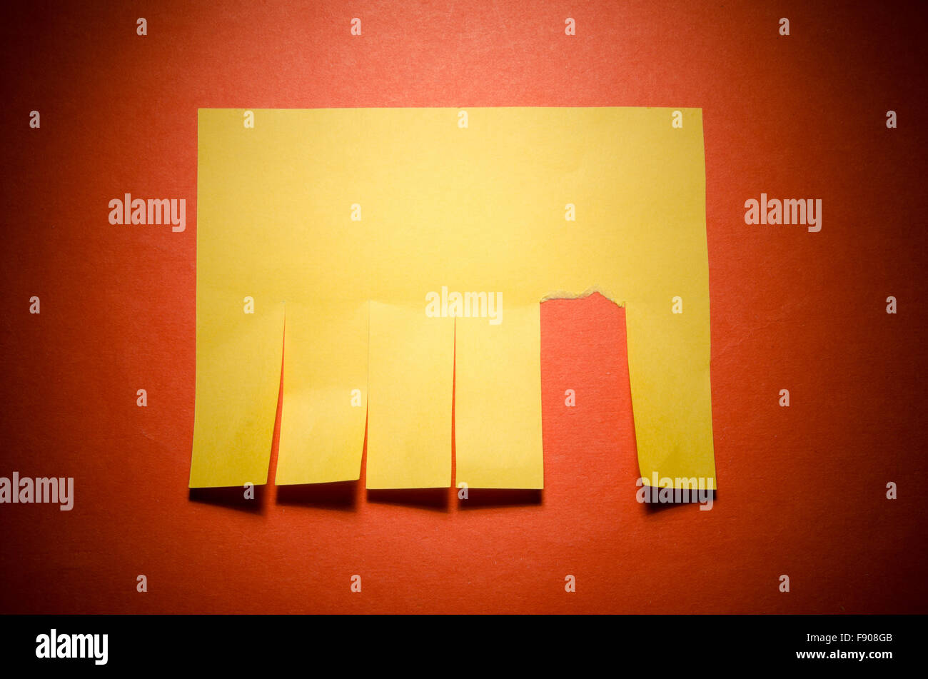 Tear off paper notice on the wall Stock Photo - Alamy