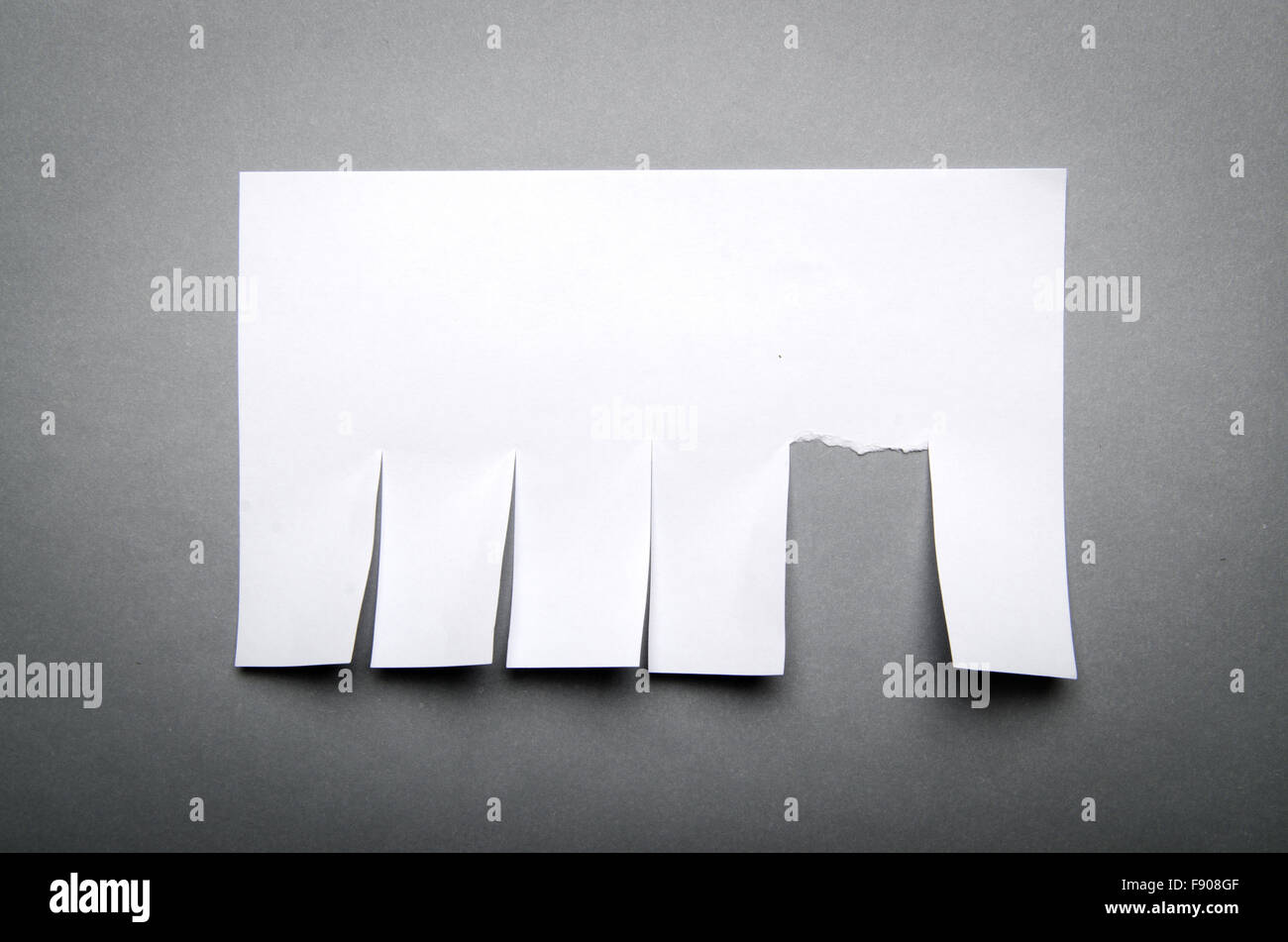 Tear off paper notice on the wall Stock Photo - Alamy