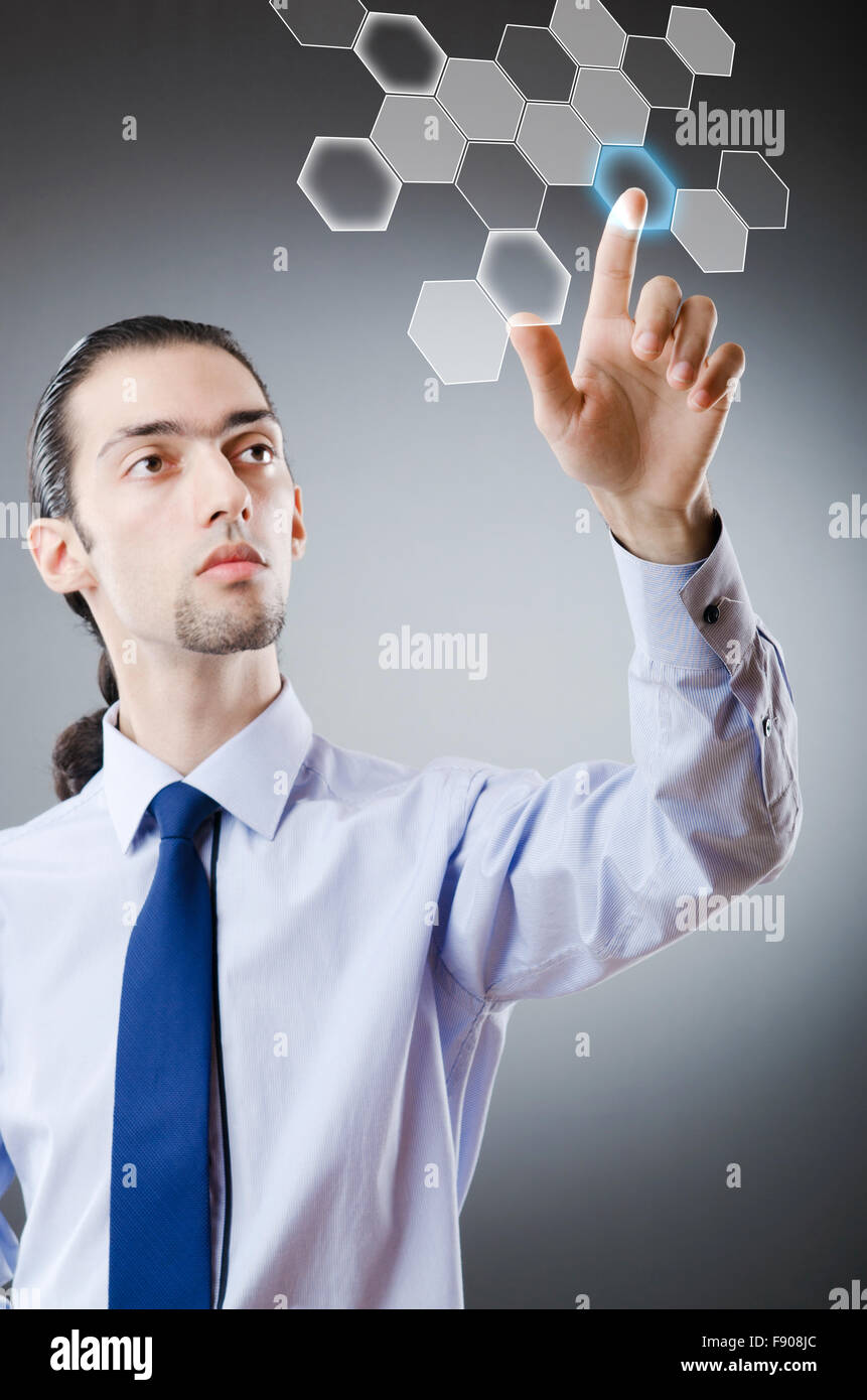 Businessman pressing virtual buttons Stock Photo - Alamy