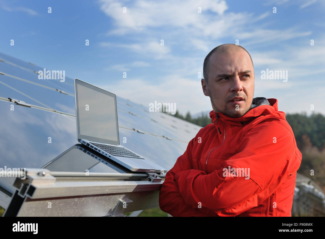 business man engineer using laptop at solar panels plant eco energy ...