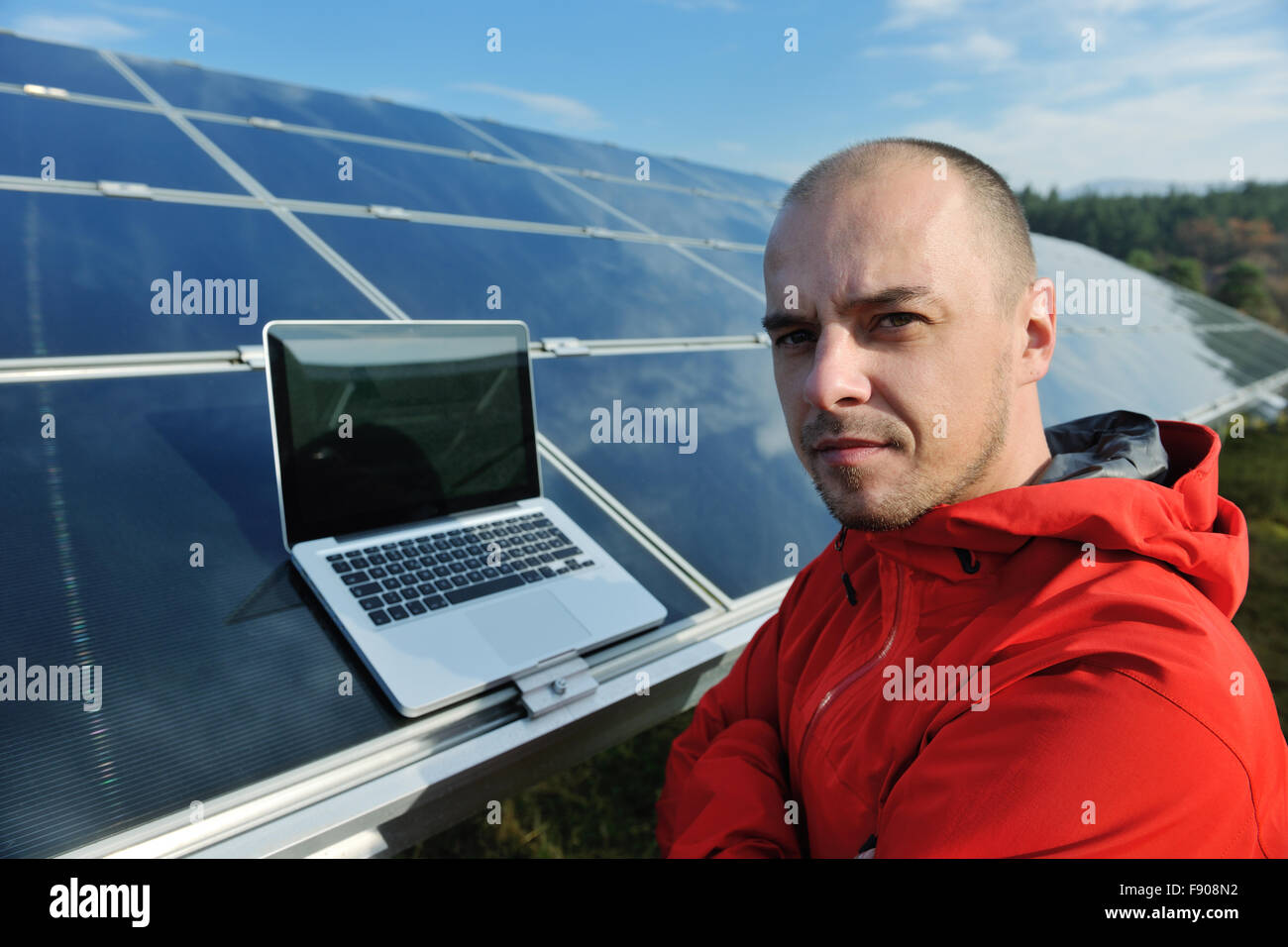 business man engineer using laptop at solar panels plant eco energy ...