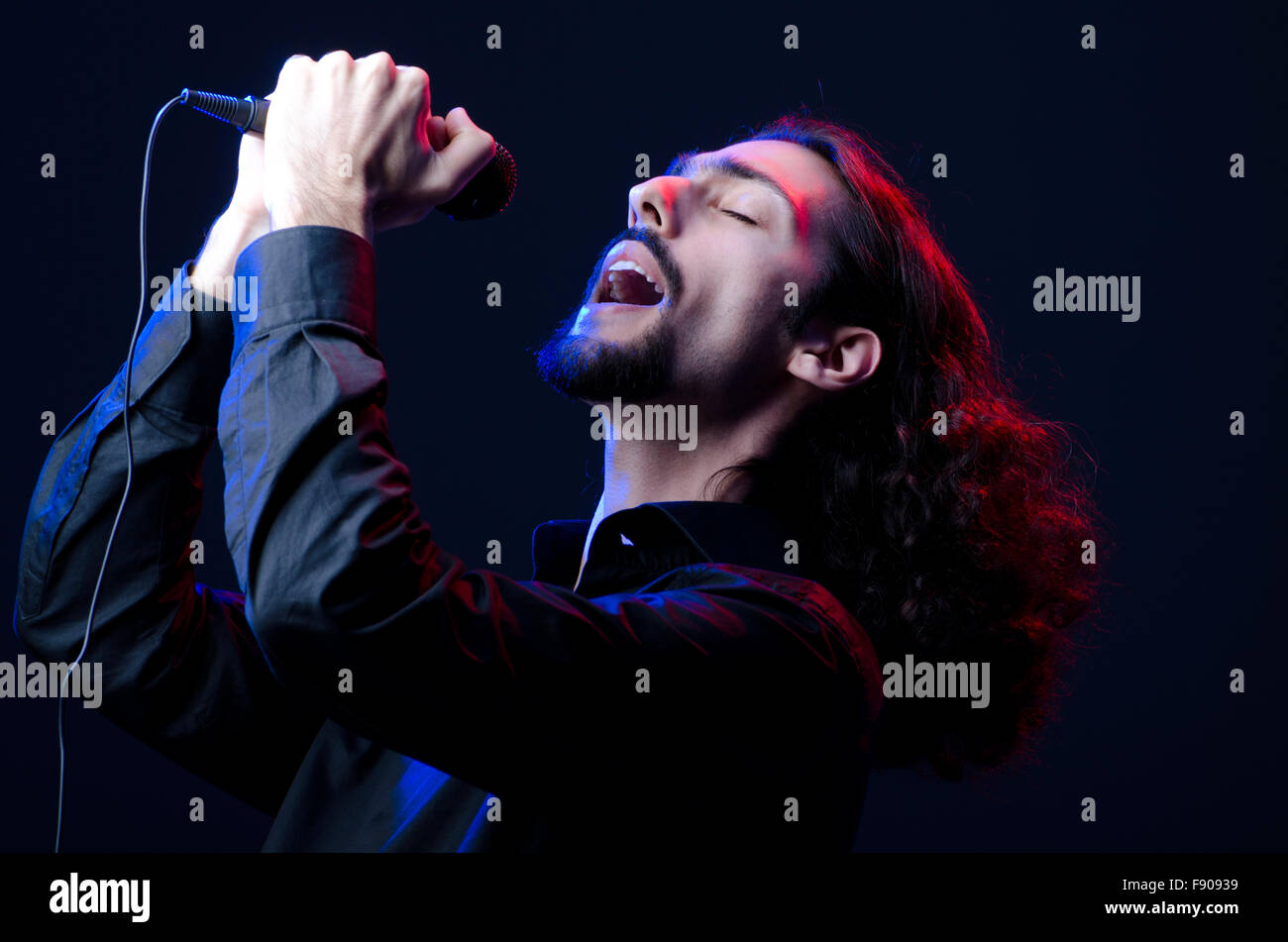 Man singing at the concert Stock Photo - Alamy
