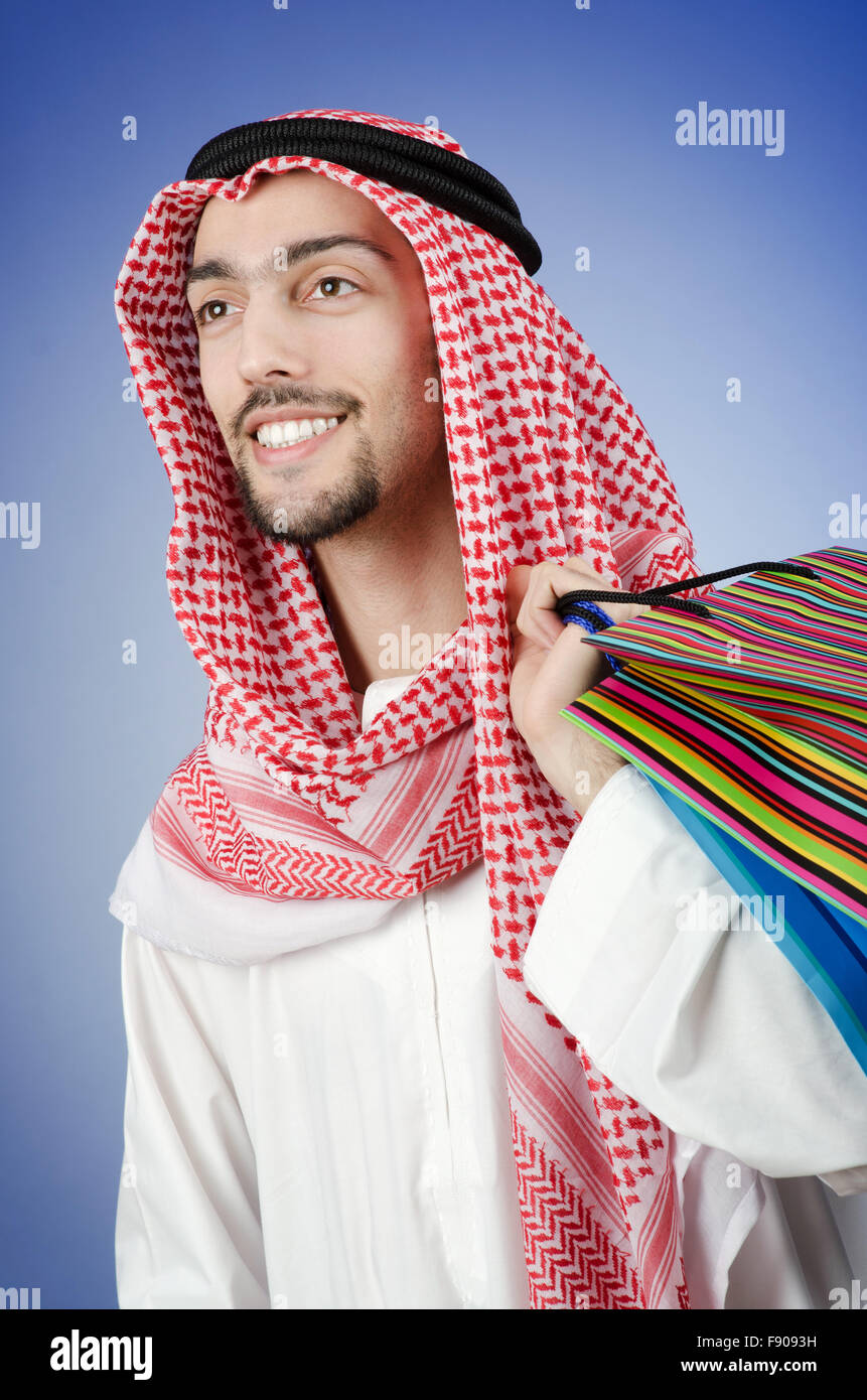 Arab with the gift bags Stock Photo - Alamy