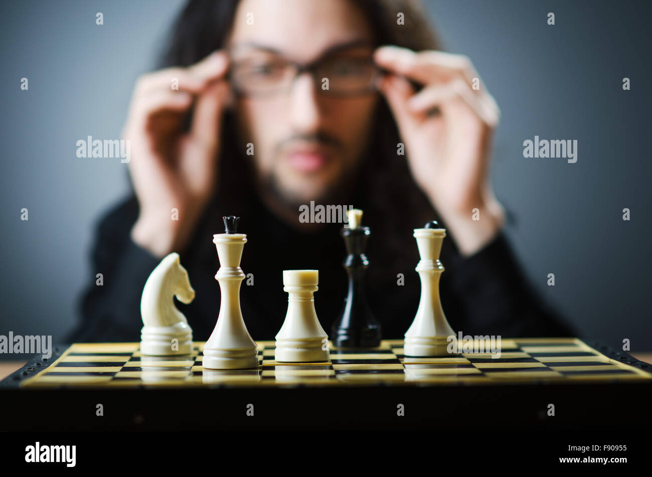Chess player playing his game Stock Photo - Alamy