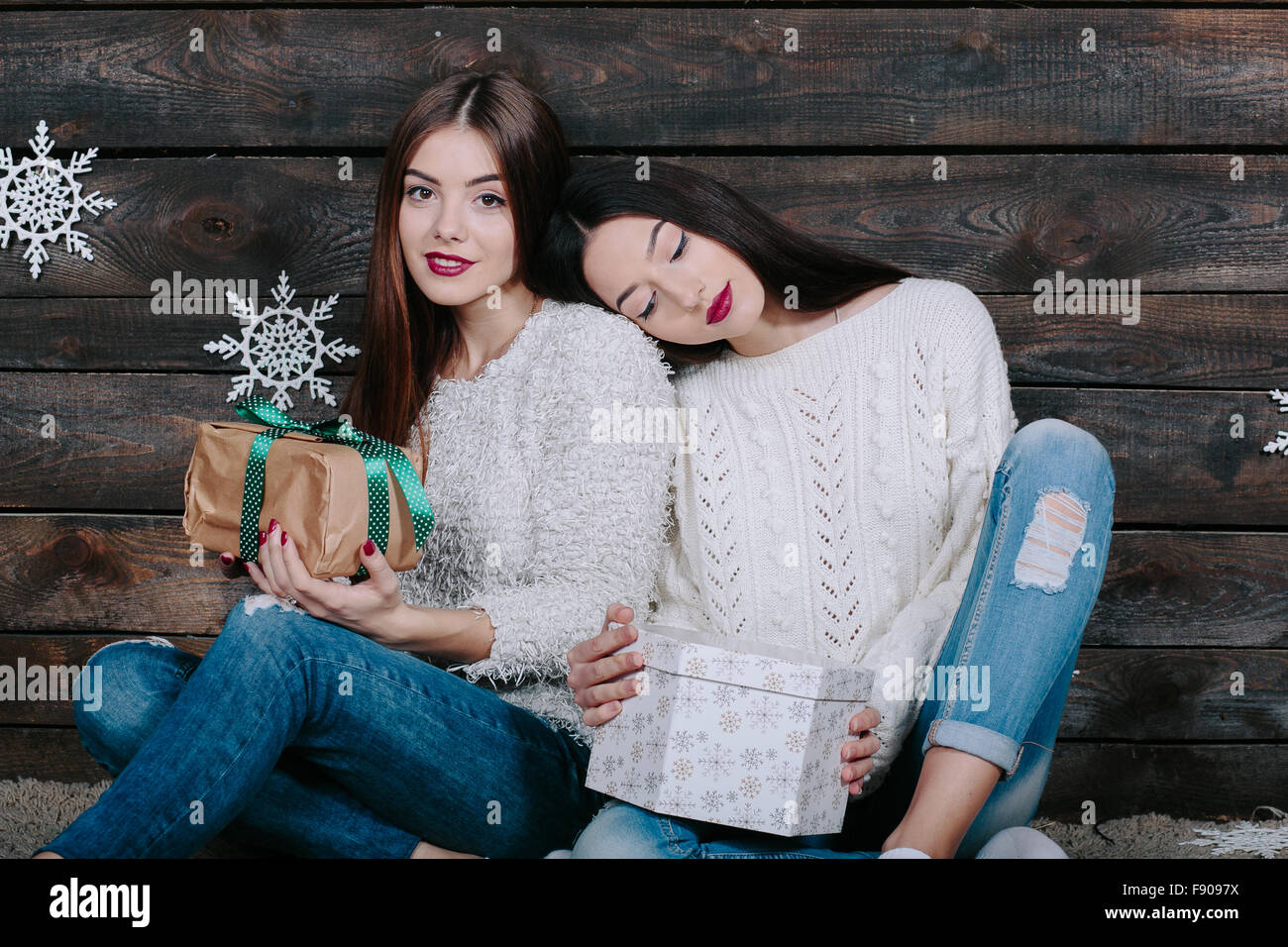 portrait of two beautiful girls at Christmas Stock Photo - Alamy
