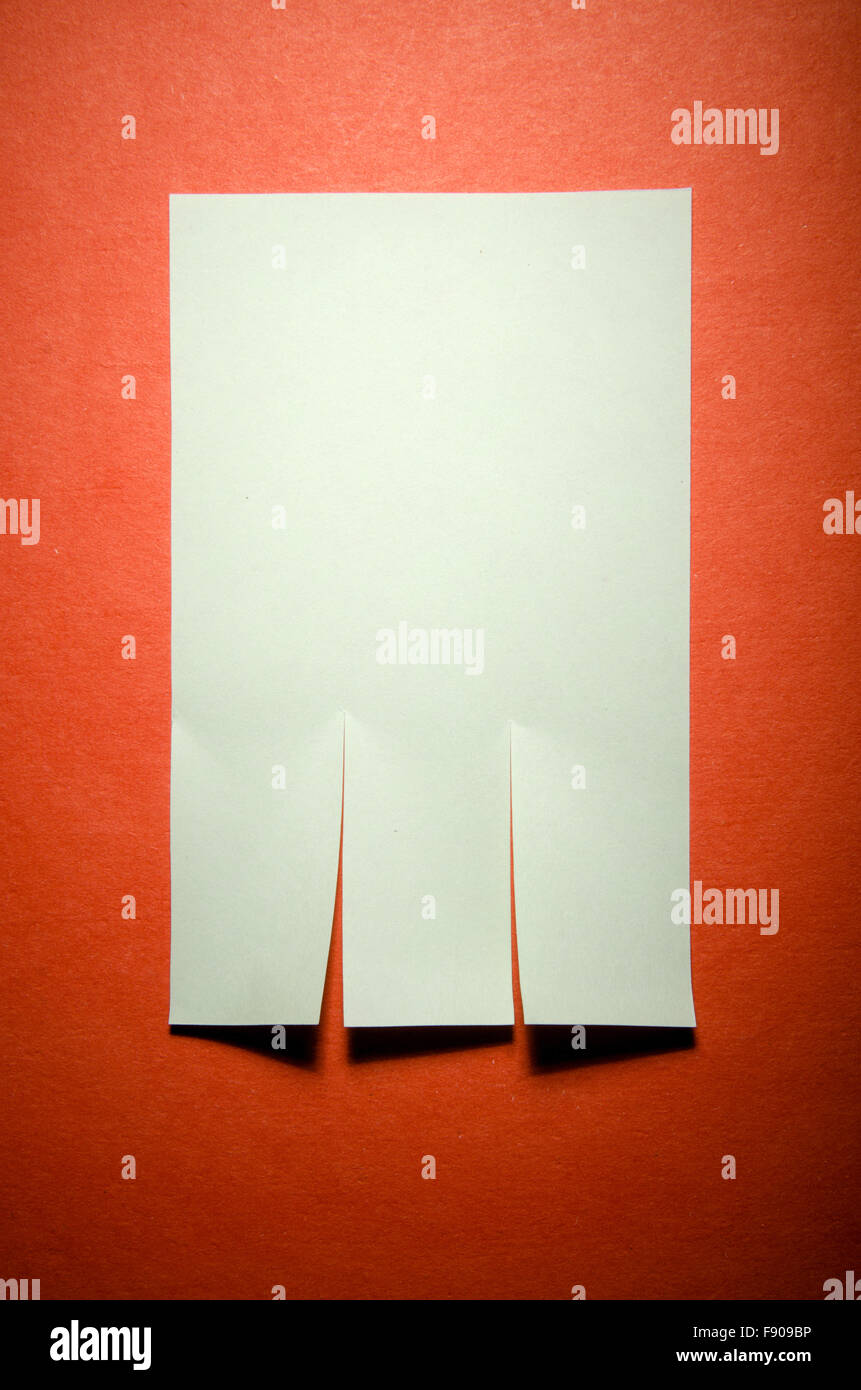 Tear off paper notice on the wall Stock Photo - Alamy