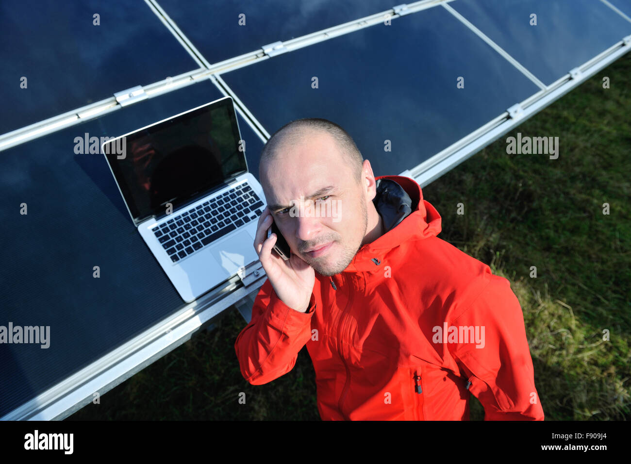 business man engineer using laptop at solar panels plant eco energy ...