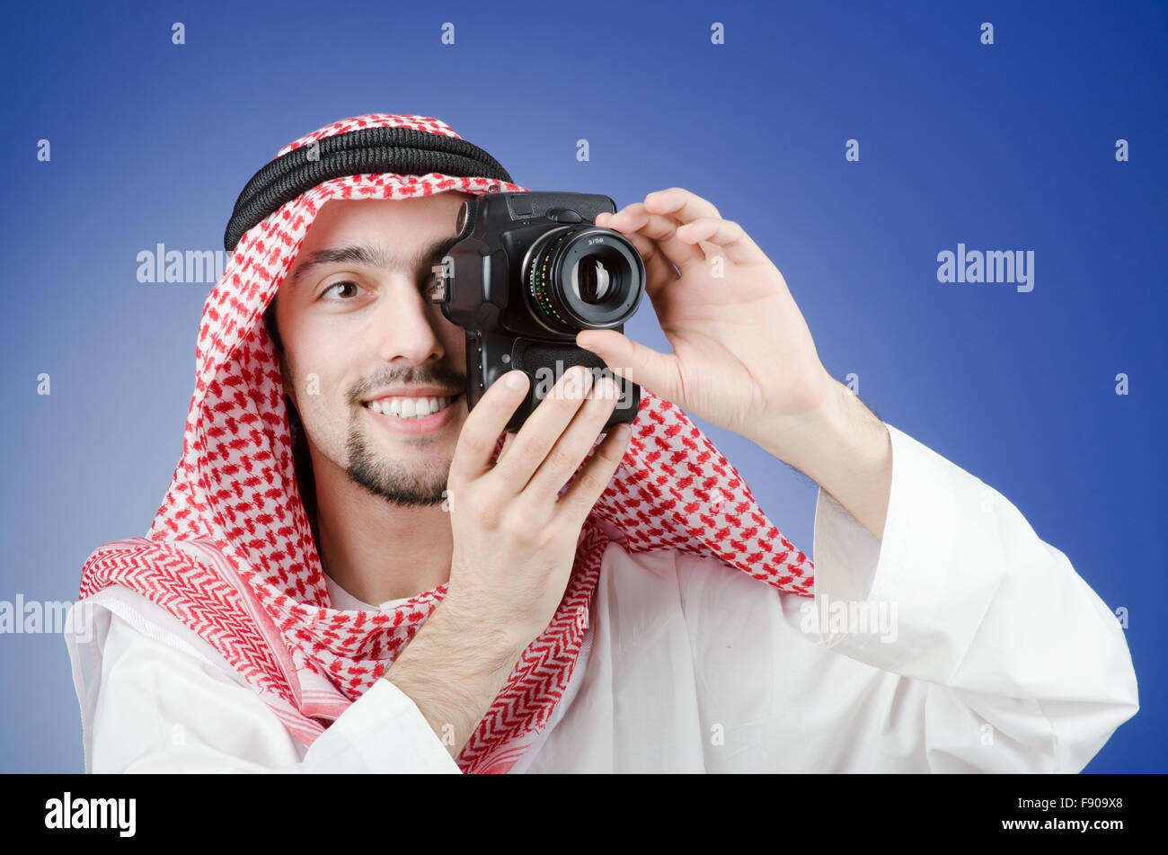 Arab photographer in studio shooting Stock Photo - Alamy