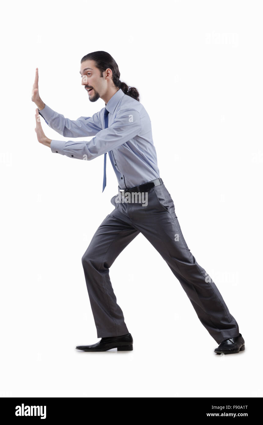 Businessman pushing away virtual obstacles Stock Photo - Alamy