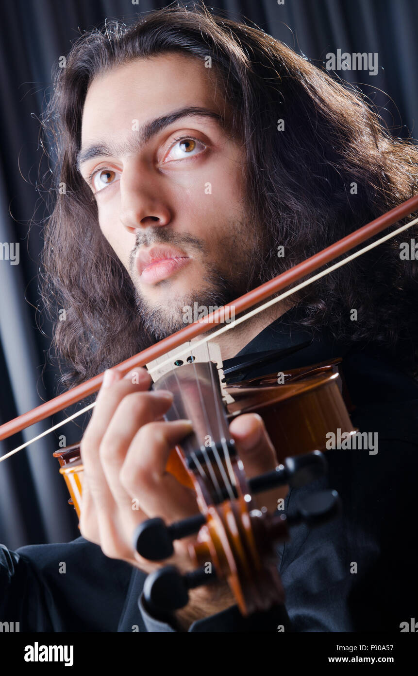 Young violin player playing Stock Photo - Alamy