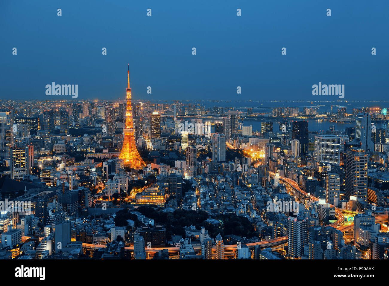 Tokyo Tower and urban skyline rooftop view at night, Japan Stock Photo ...