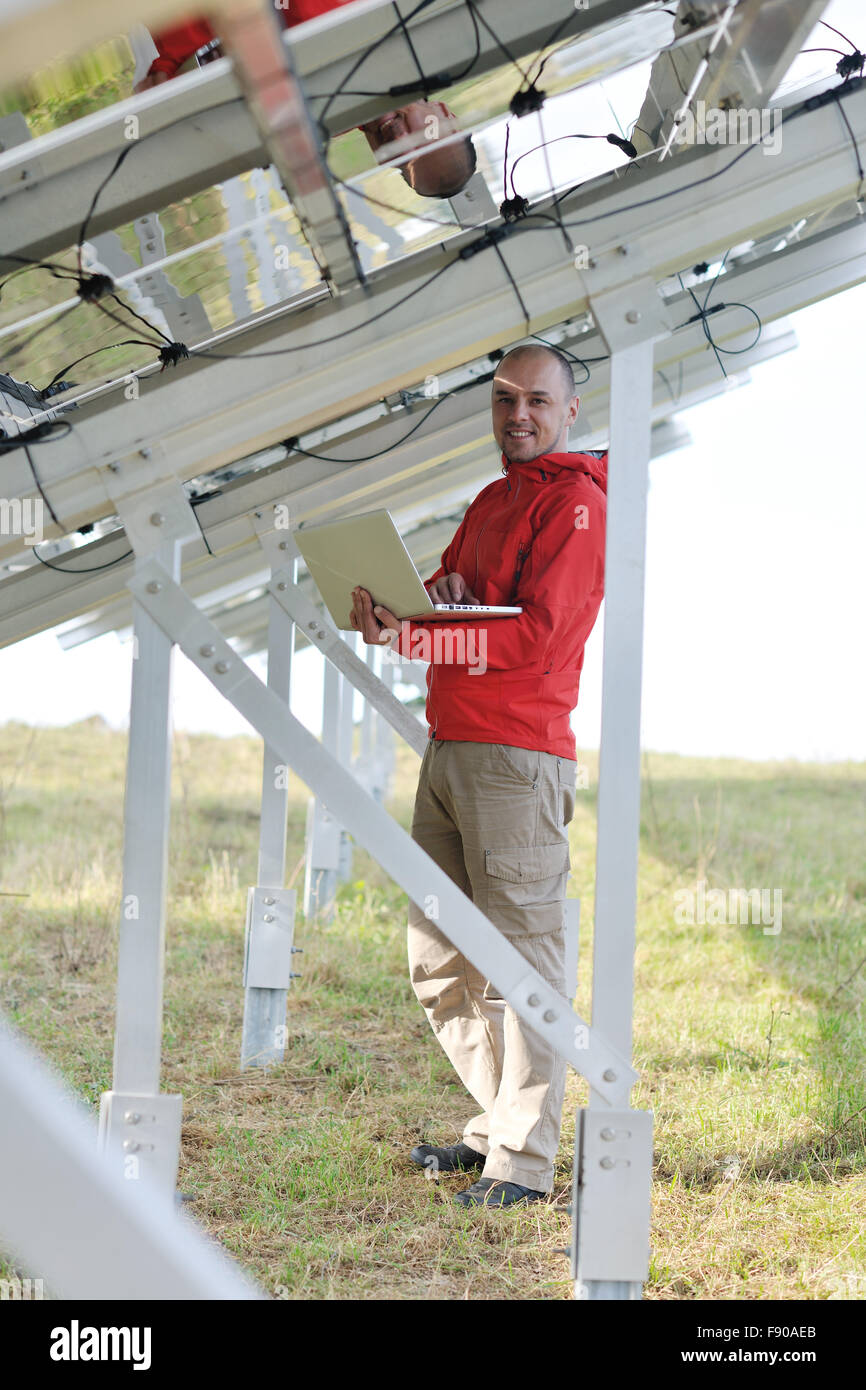 business man engineer using laptop at solar panels plant eco energy ...