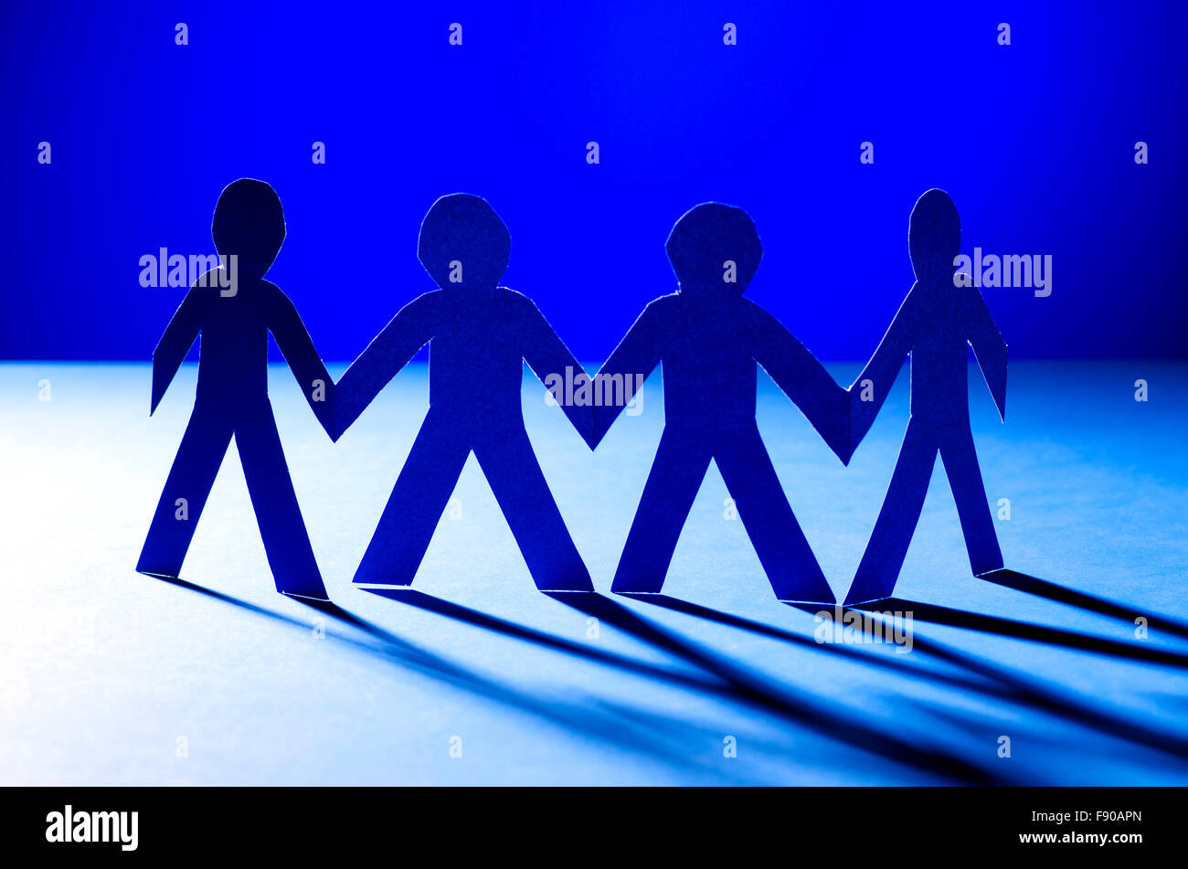 Paper people in teamworking concept Stock Photo - Alamy