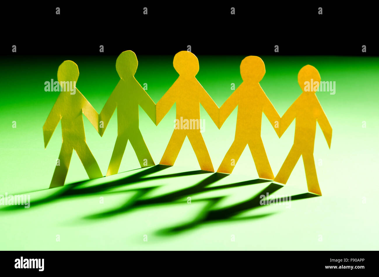 Paper people in teamworking concept Stock Photo - Alamy