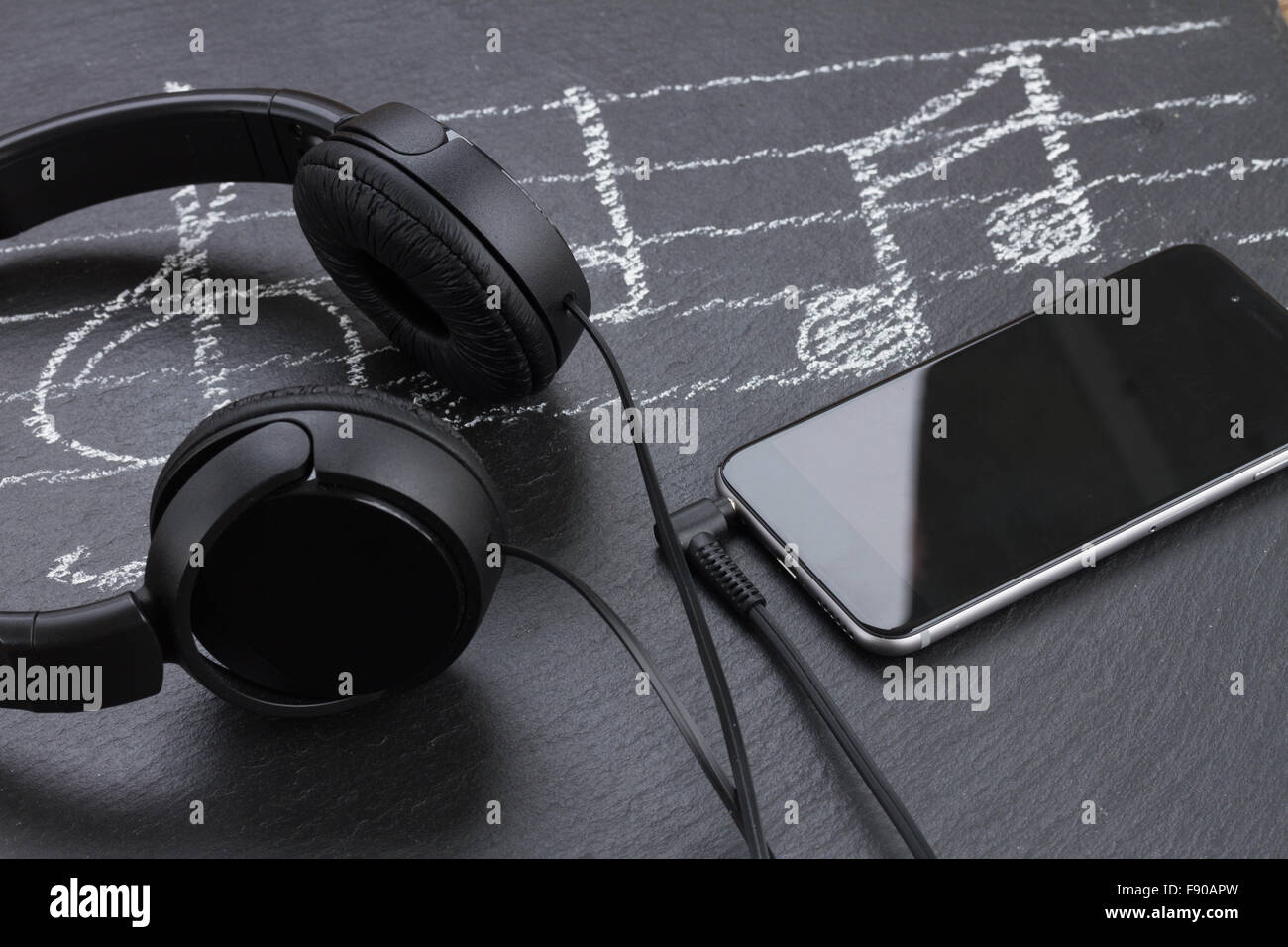 Music notes with headphones Stock Photo - Alamy