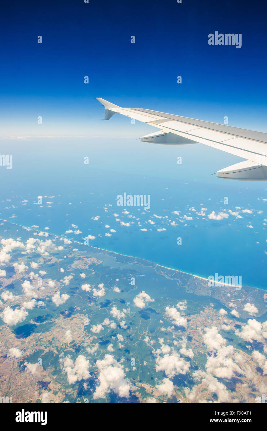 Airplane wing out of window Stock Photo - Alamy