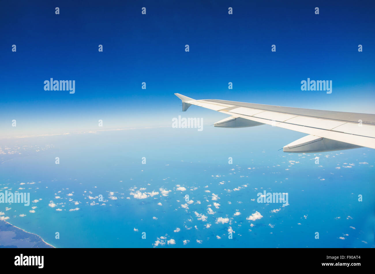 Airplane wing out of window Stock Photo - Alamy