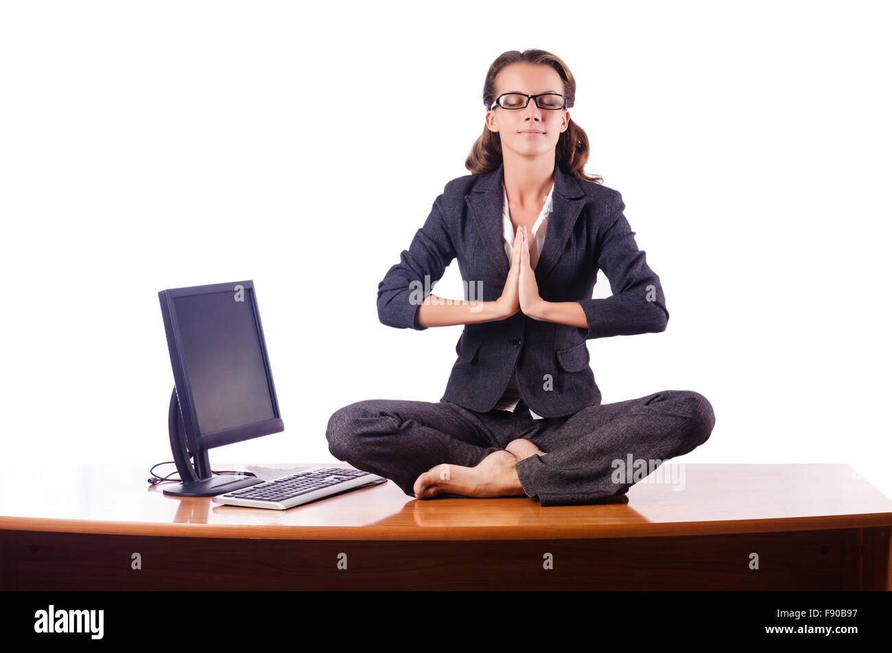 Woman meditating on the desk Stock Photo - Alamy