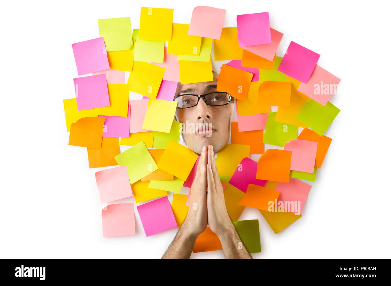 Man's face through paper and reminders Stock Photo - Alamy
