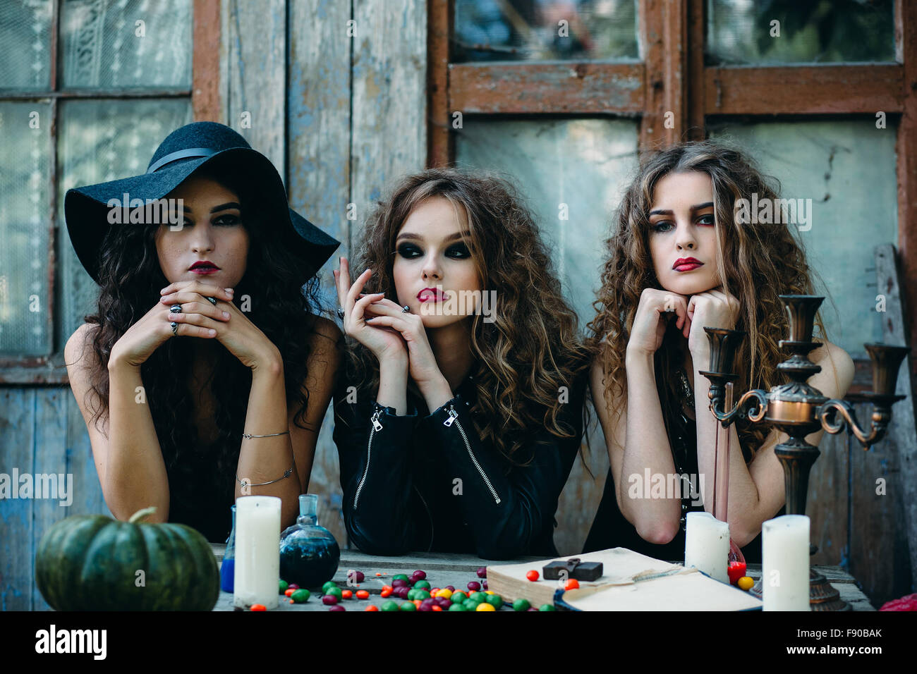 three witches at the table Stock Photo - Alamy