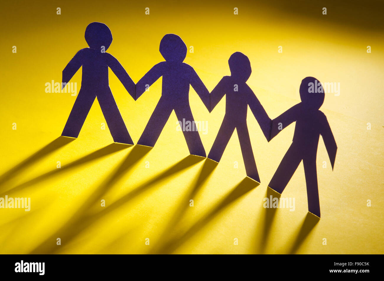 Paper people in teamworking concept Stock Photo - Alamy