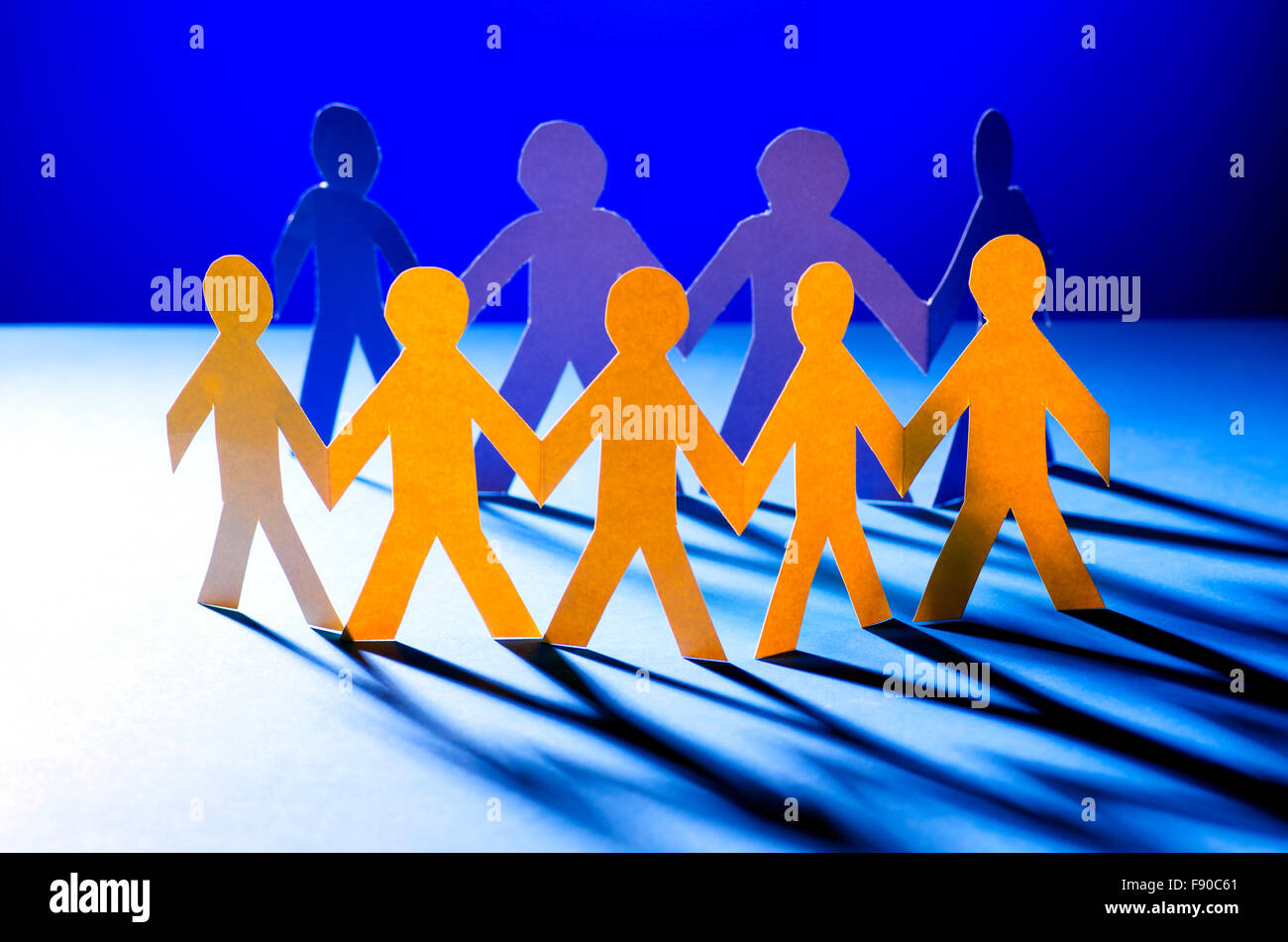Paper people in teamworking concept Stock Photo - Alamy