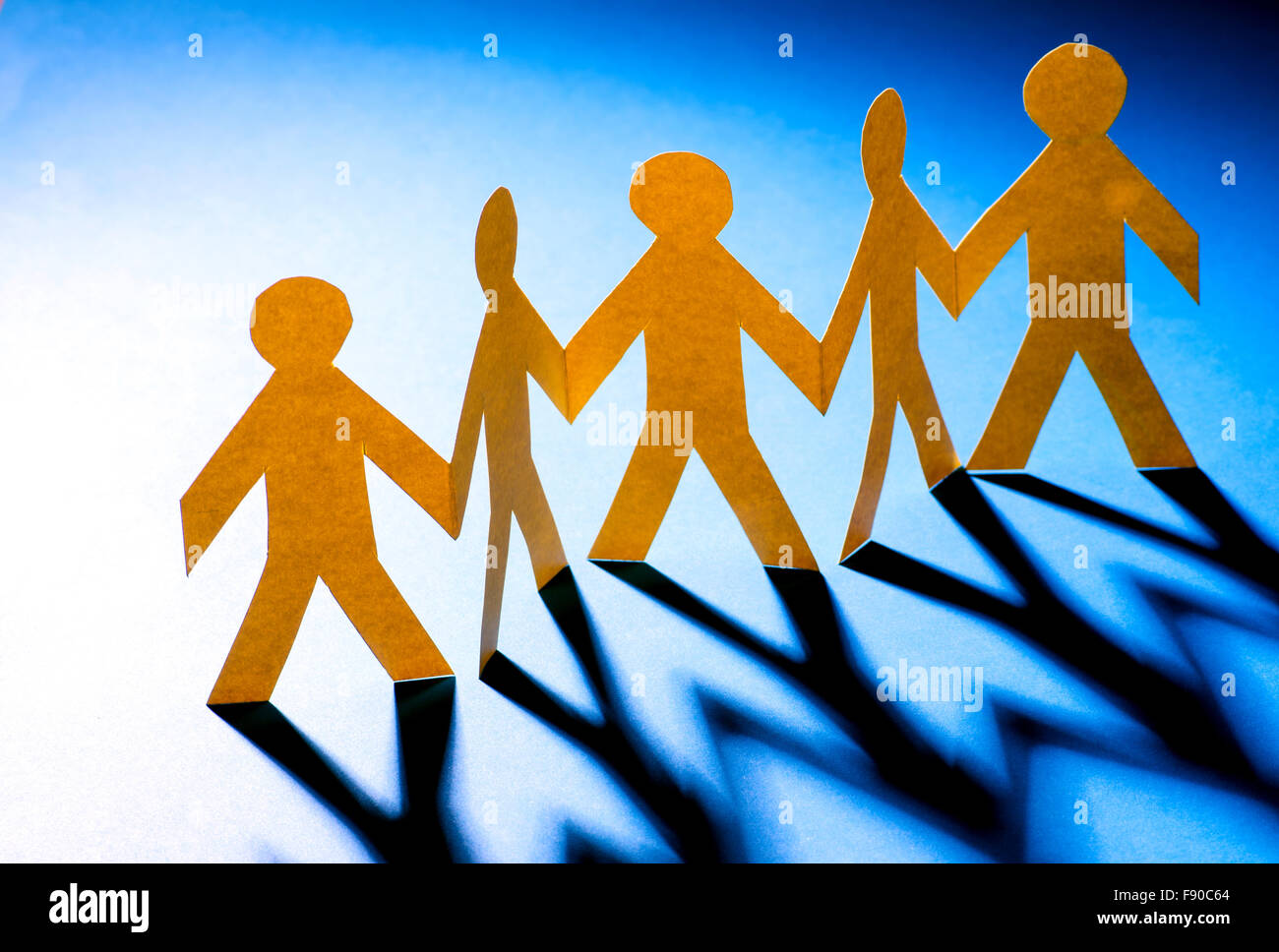 Paper people in teamworking concept Stock Photo - Alamy