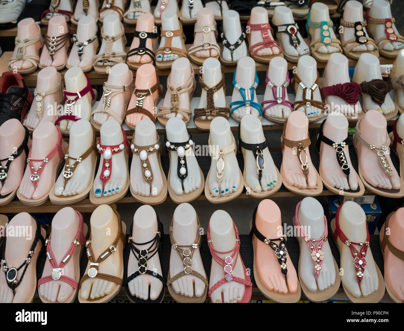 Close up of colorful sandals in textile market (souk) in Dubai heritage ...