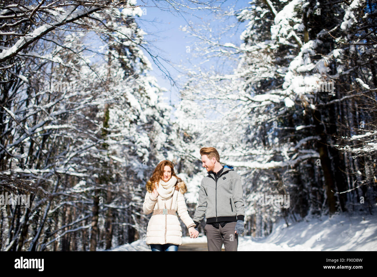 Young happy couple fun snow hi-res stock photography and images - Alamy