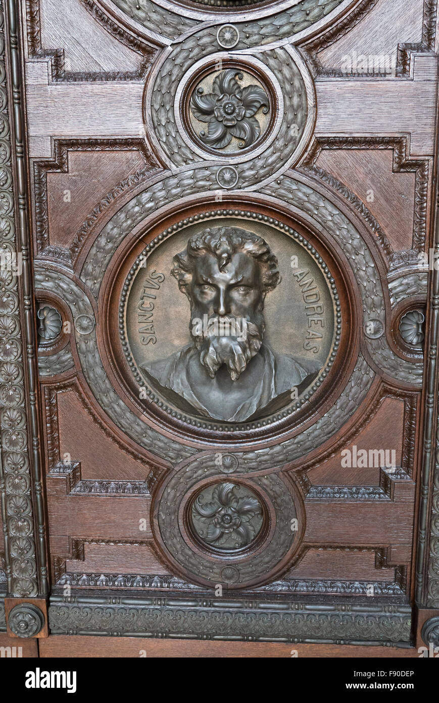 A bas relief face of historic figure on a door at the entrance of the ...