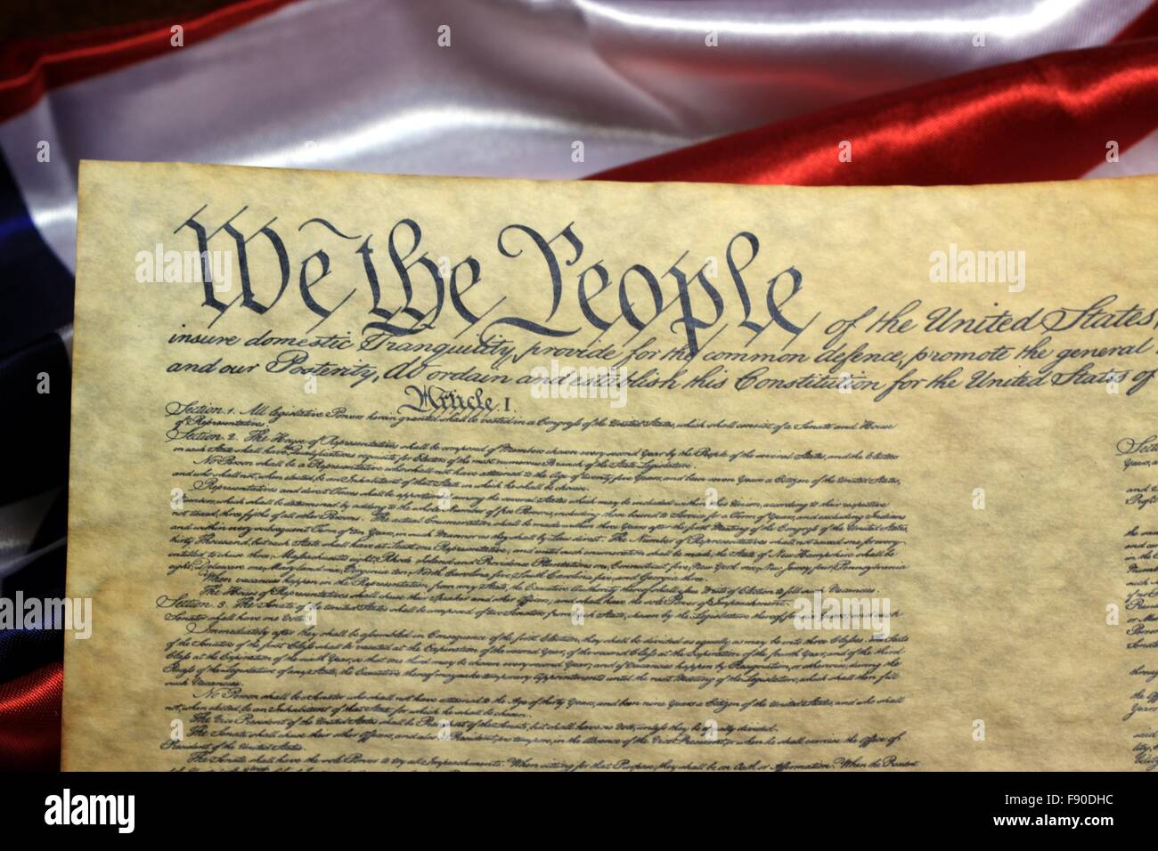 Historical Document US Constitution - We The People with American Flag Stock Photo - Alamy