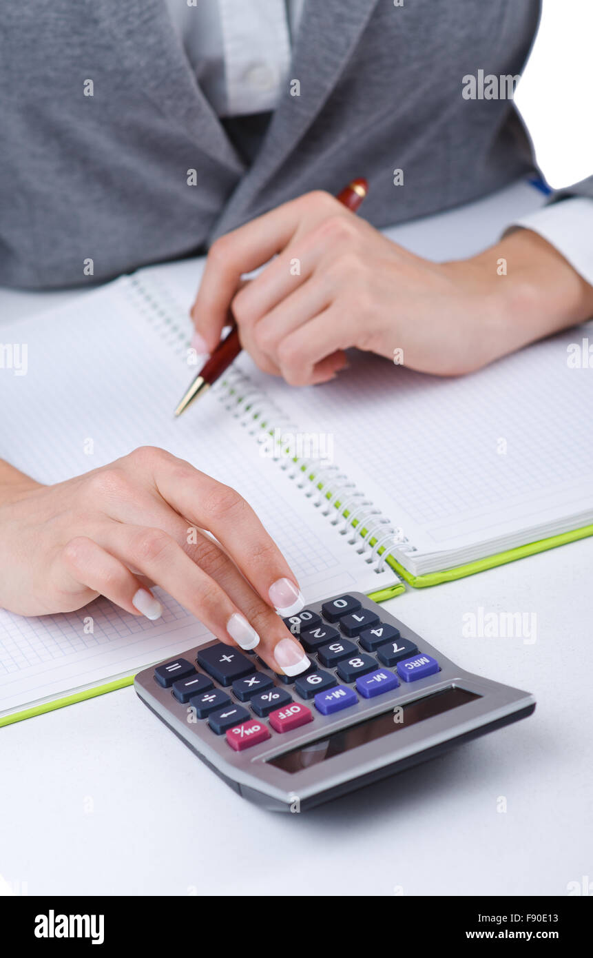 Hands working on the calculator Stock Photo - Alamy