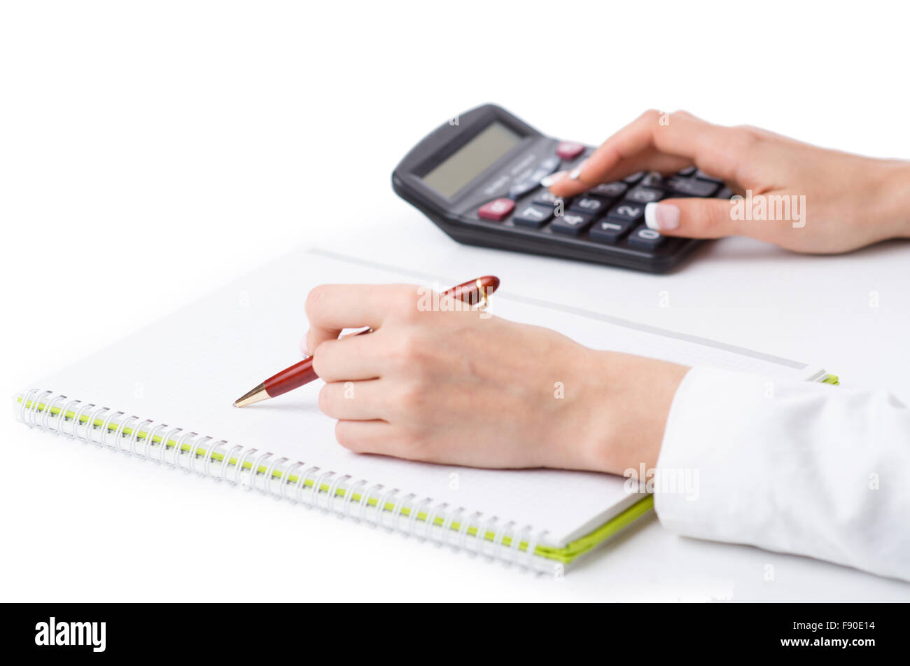 Hands working on the calculator Stock Photo - Alamy