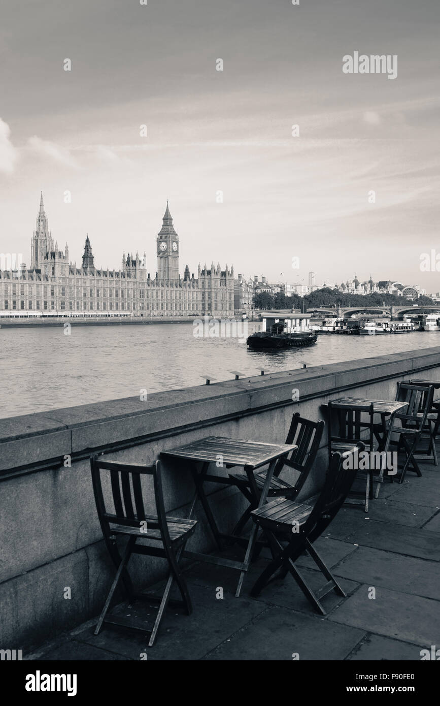 Chairs at waterfront of Thames River with Big Ben and House of ...