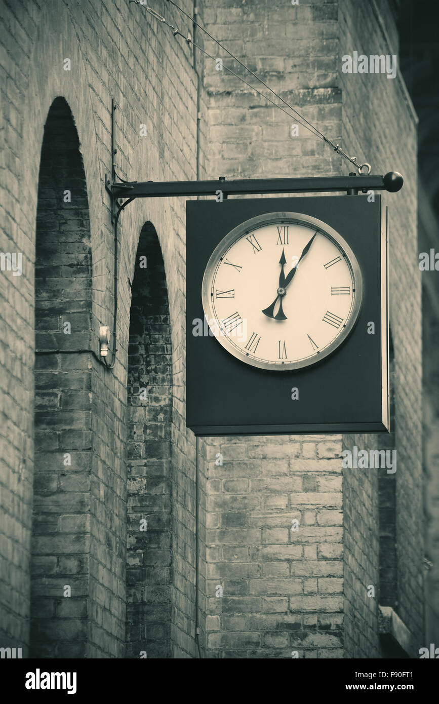 Urban historical architecture with vintage clock in street in London ...