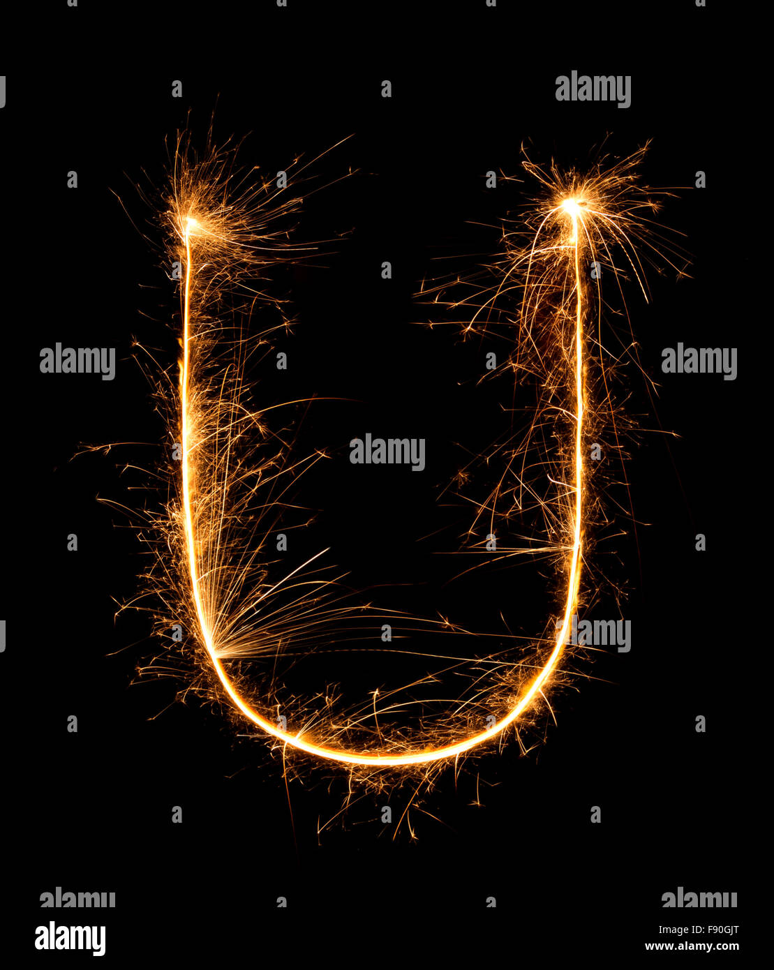 Sparkler firework light alphabet U (Capital Letters) at night ...