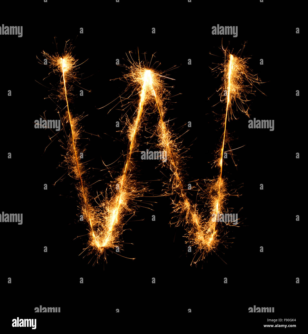 Sparkler firework light alphabet W at night background Stock Photo - Alamy