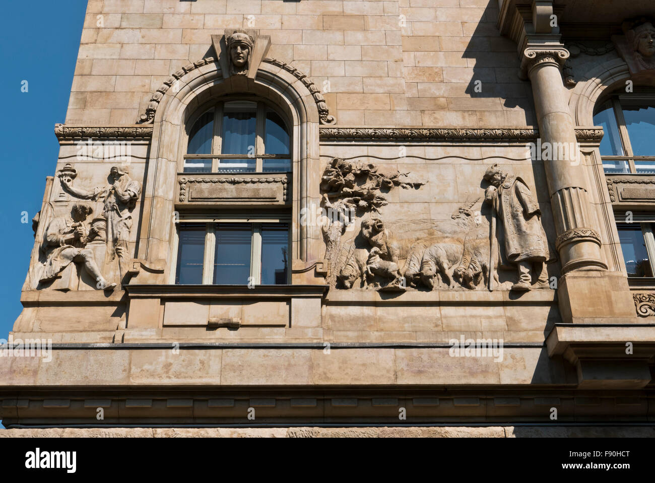 Stone carvings on the exterior wall of a building in Budapest, Hungary ...