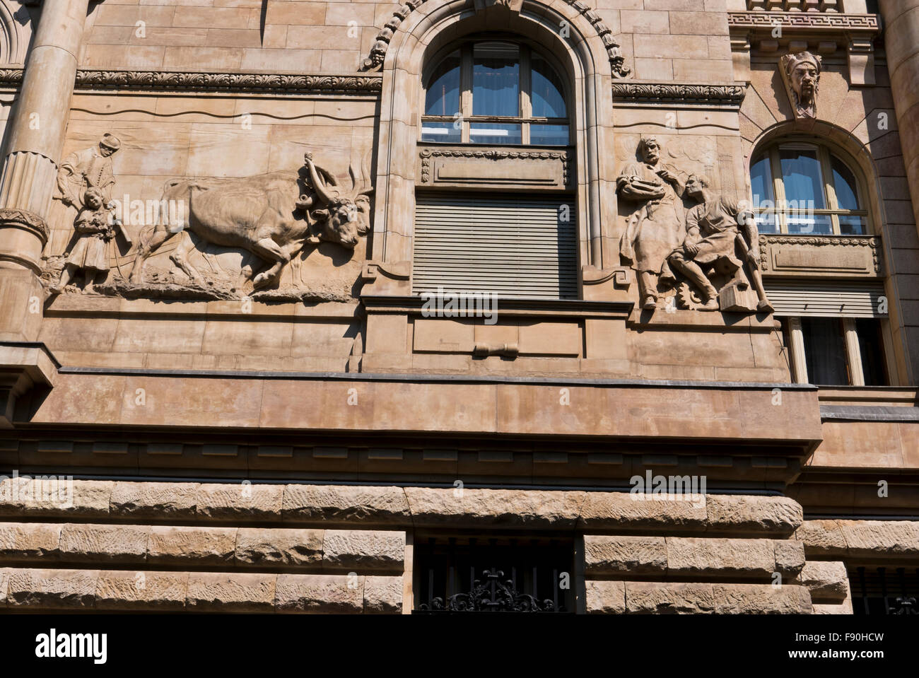 Stone carvings on the exterior wall of a building in Budapest, Hungary ...