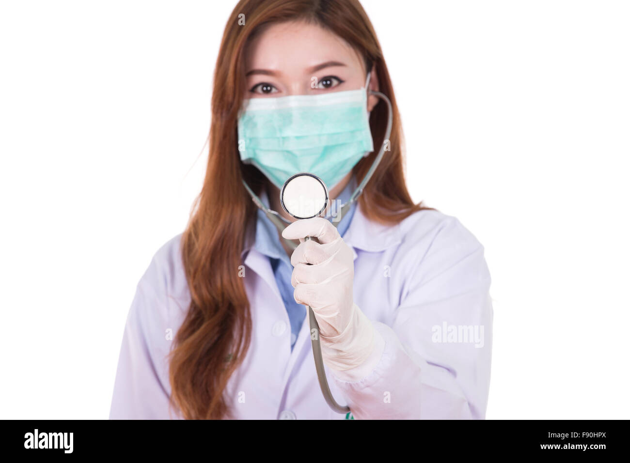 Female doctor with mask and stethoscope isolated on white background ...