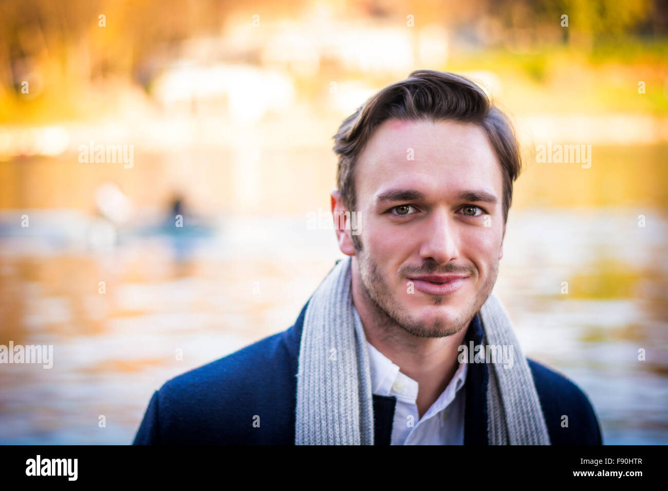 Handsome young man outdoor in winter fashion, wearing black coat and ...