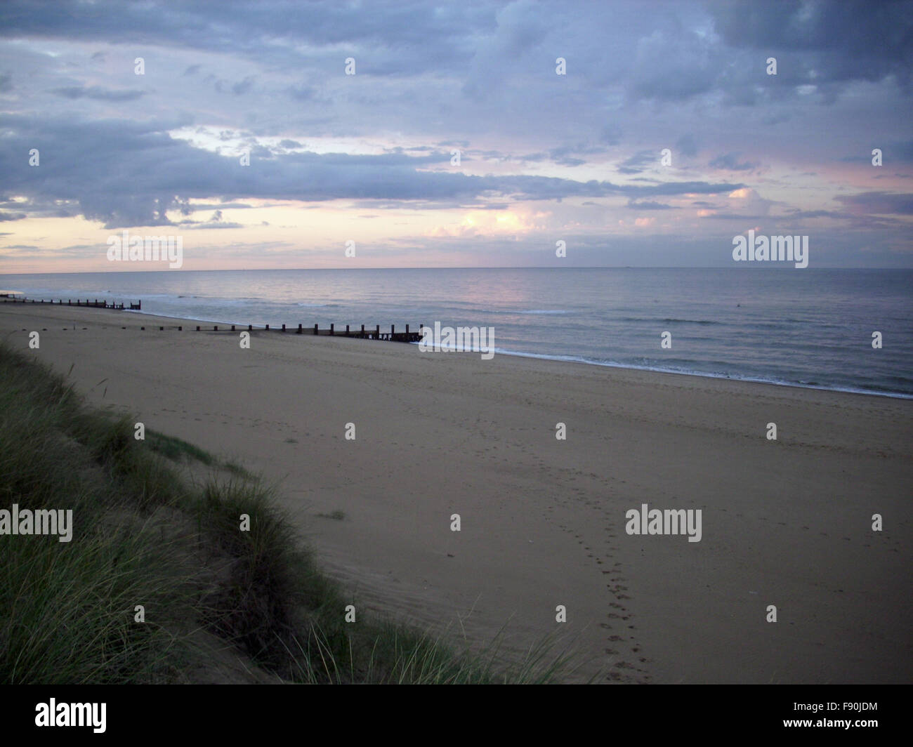 Beach, breakwaters and sea Stock Photo - Alamy